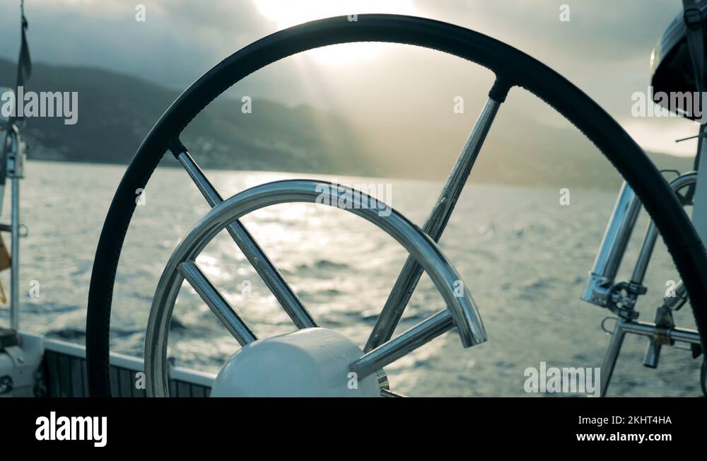Black helm on a yacht in sea Stock Video Footage - Alamy