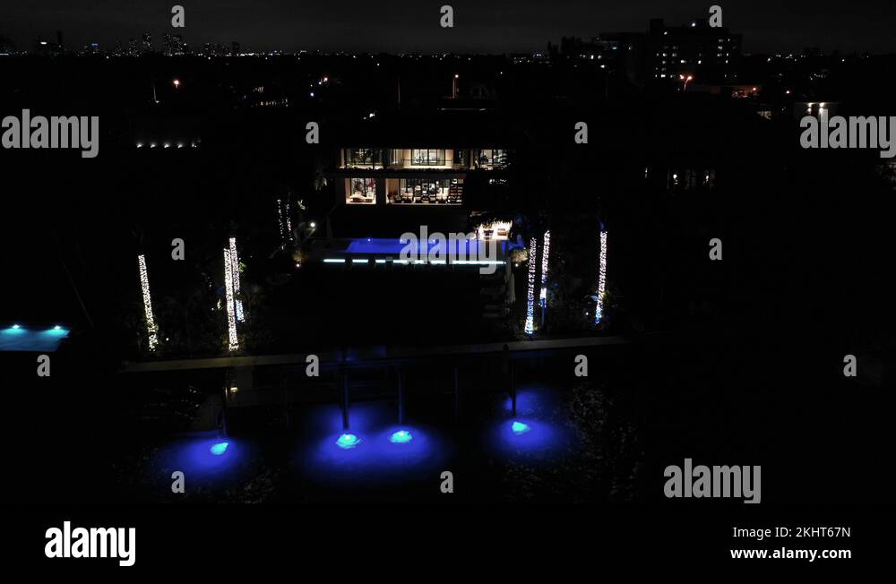 Luxury Miami Beach waterfront mansion with blue lights at night Stock ...
