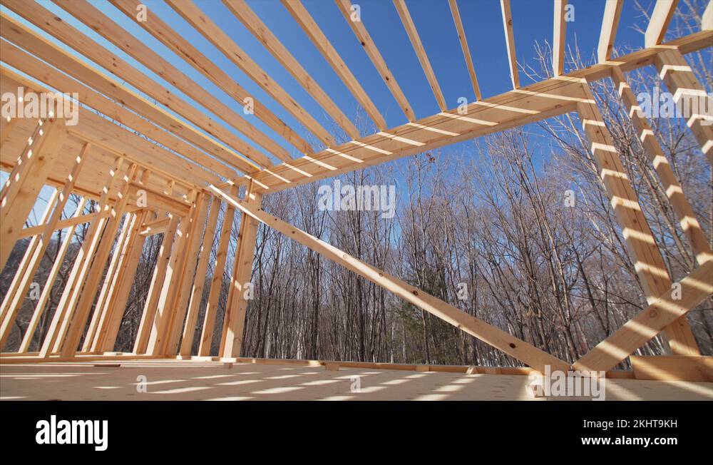 Zooming in view of big future window and forest seen through it. Frame ...