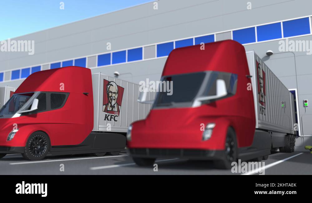Electric trailer trucks with KFC logo being loaded or unloaded at ...