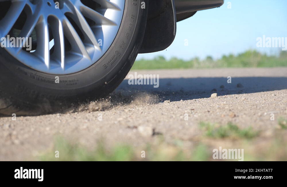 Wheel of car are slip on a dirt road during start of movement. Slow ...