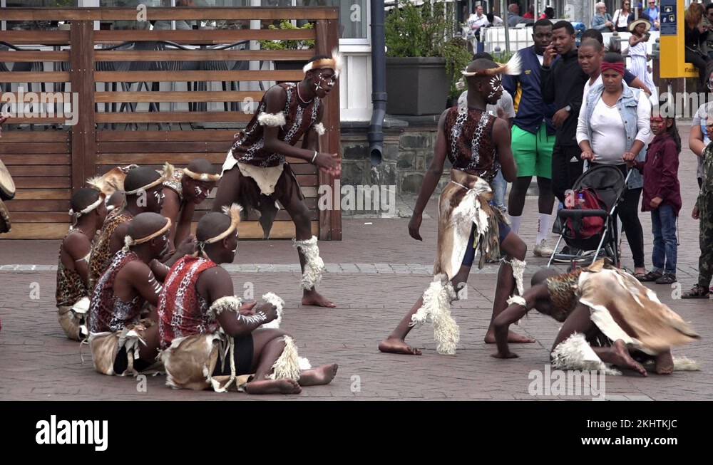 A group of African people performing folk dance at Central square of ...
