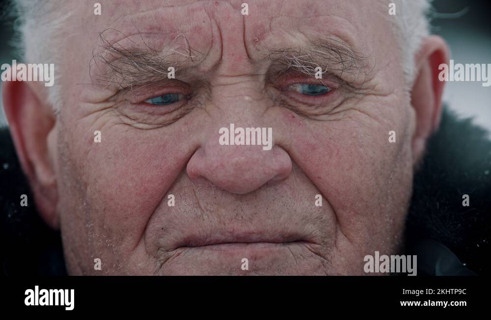 Elderly grandfather - portrait of a smiling grandfather with golden ...
