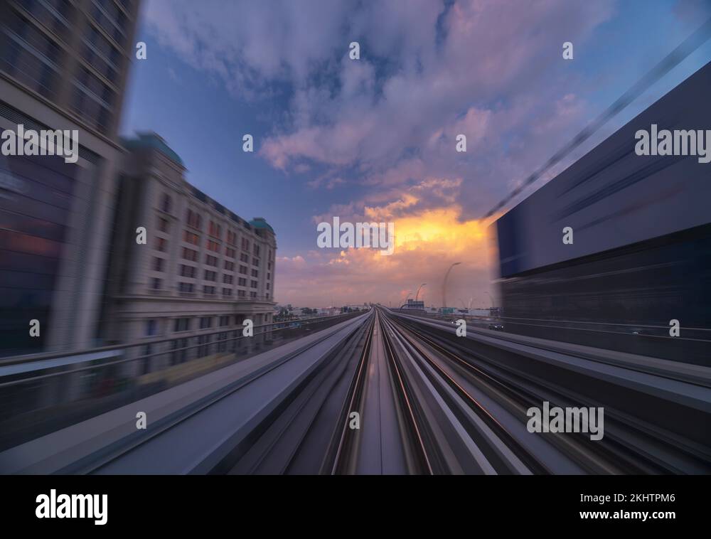 Hyper lapse of Dubai Metro train during sunrise - Dubai Stock Video ...