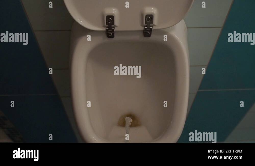 Man point of view while peeing in the urinal. Male urinating and ...