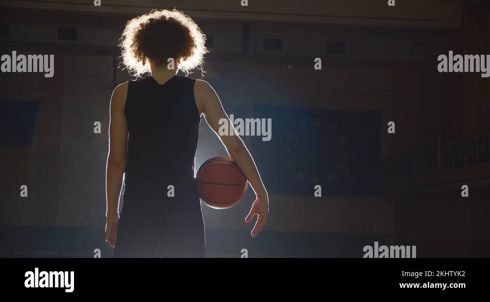 Young guy curly basketball player darkness silhouette getting ready ...