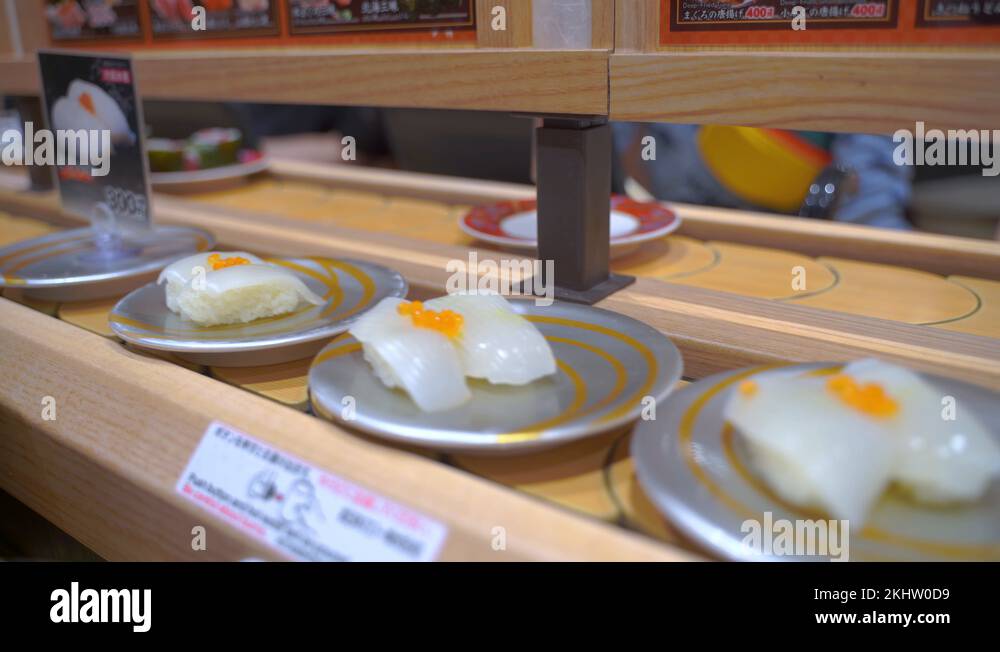 Sushi rail restaurant with rotating Japanese food plates in 4k Stock ...