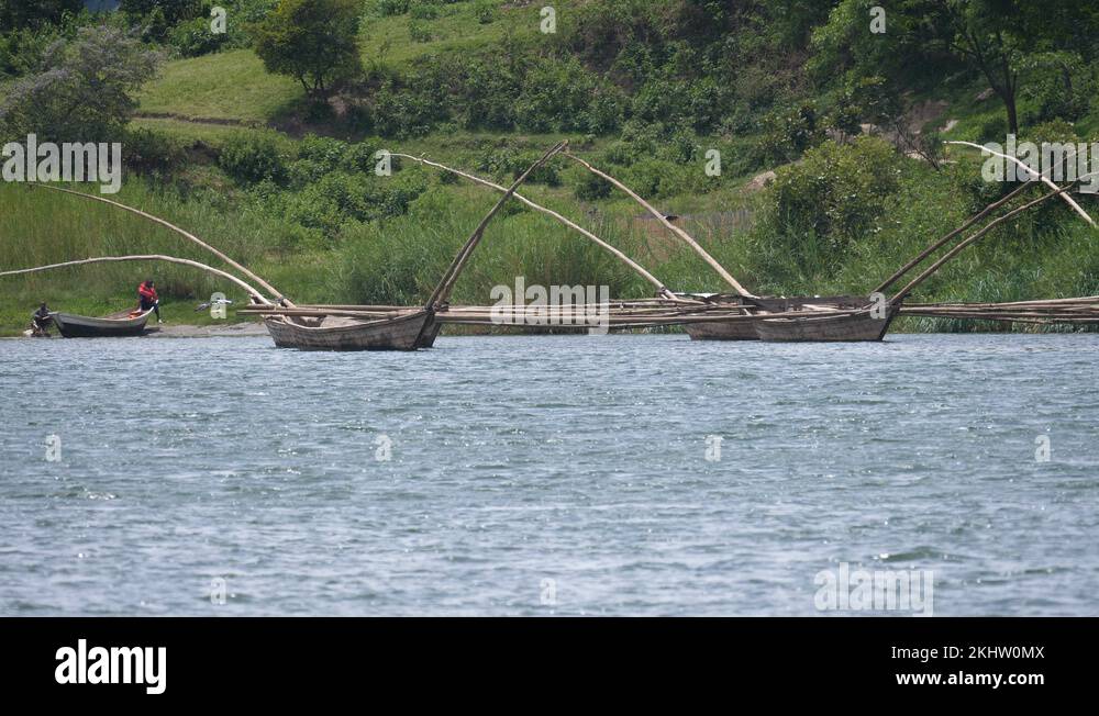 Boats on lake Kivu, Rwanda Stock Video Footage - Alamy