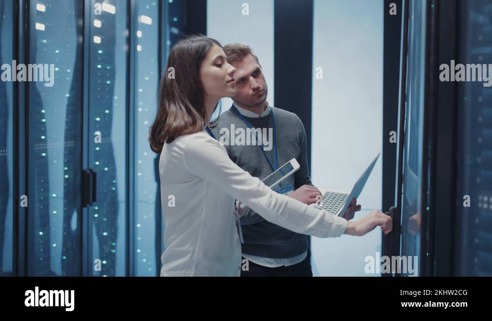 Cooperative team of server engineers doing important data management ...