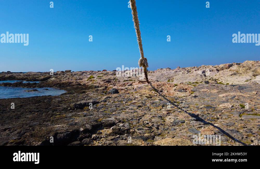 The mooring rope of a large ferry ship that brought tourists to the ...