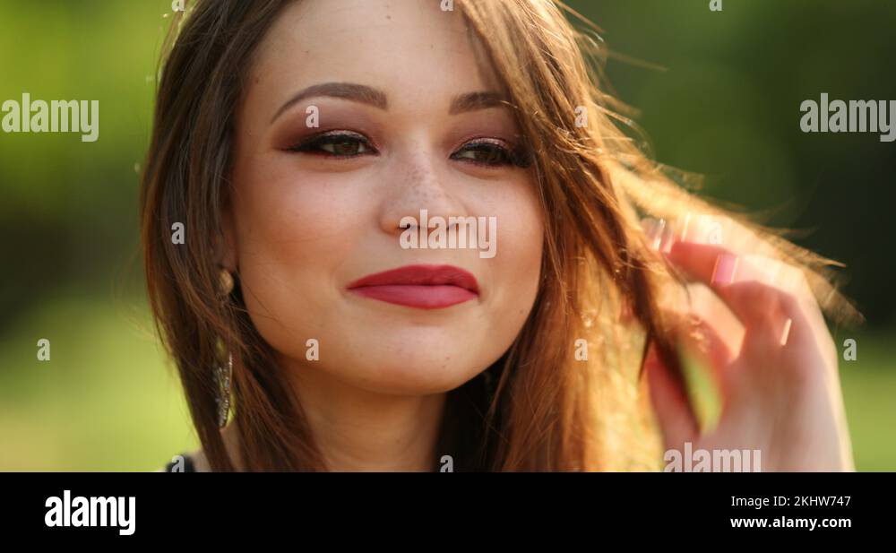 Girl thinking scratching face. Woman thinking about life scratches lip ...