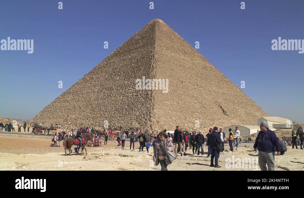 Tourists visit the Great Pyramid of Giza in greater Cairo, Egypt Stock ...