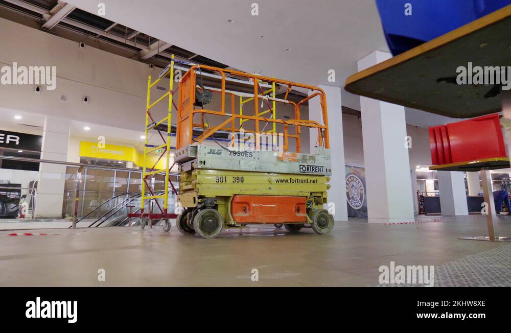 modern scissor lift and scaffolding at construction in mall Stock Video ...