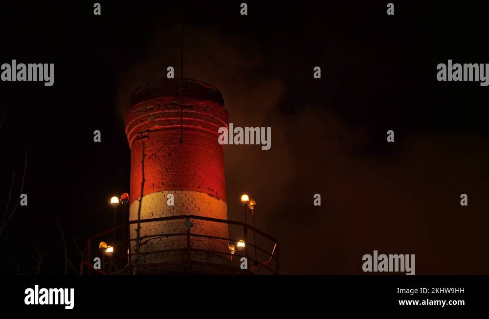 Smoke comes from the pipe of the thermal power plant. Night time Stock ...