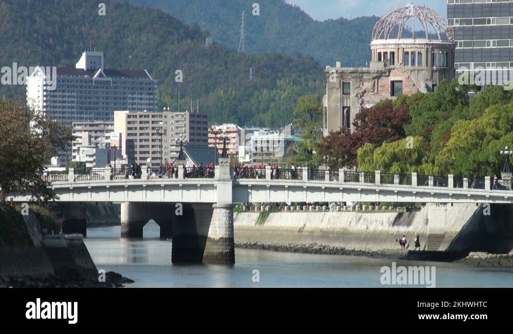 'Atomic Bomb Dome' in Hiroshima behind a bridge and river Stock Video ...