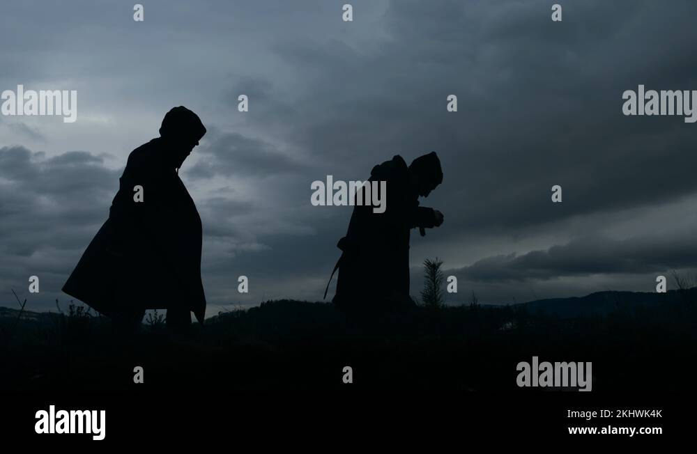 Two Young Guys On Cloudy Sky Background At Dusk. One Guy Hits The Other ...