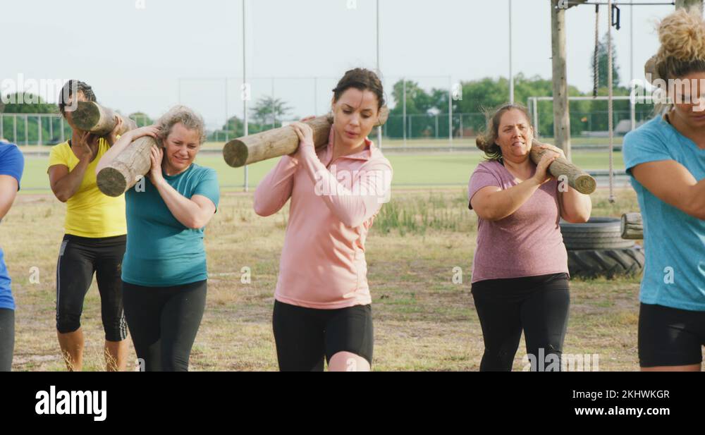 Female friends enjoying exercising at boot camp together Stock Video ...