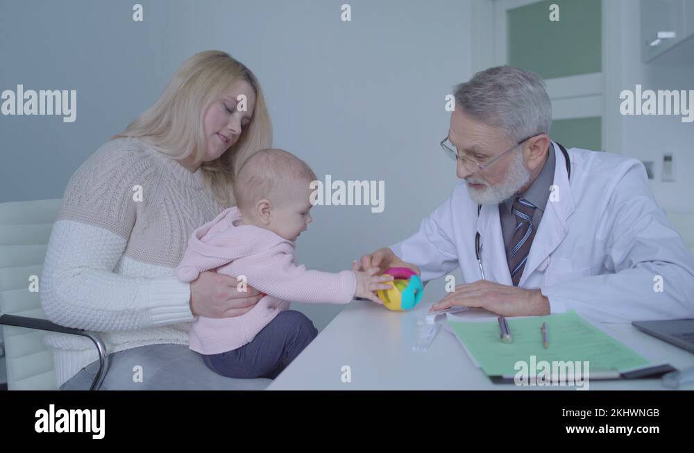 Smiling doctor examining crying Stock Videos & Footage - HD and 4K ...