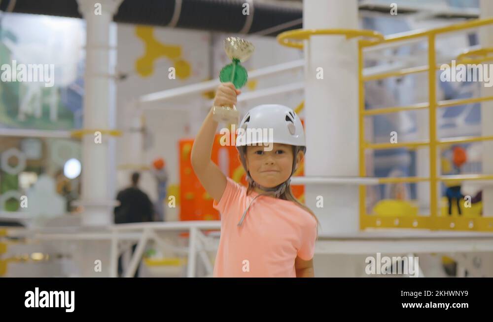 Little girl winning first prize in competition in adventure park Stock ...