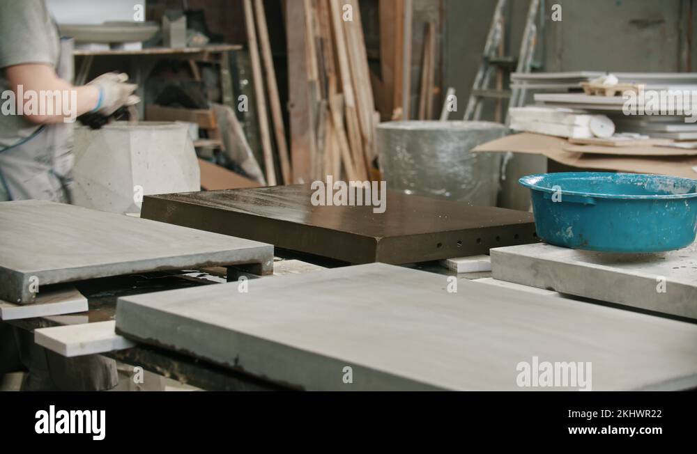 Working in the concrete industry - washing the concrete slab with water ...