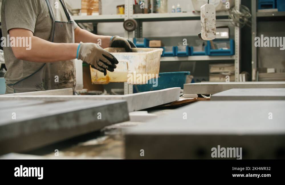 Working in the concrete industry - washing the concrete slab with water ...