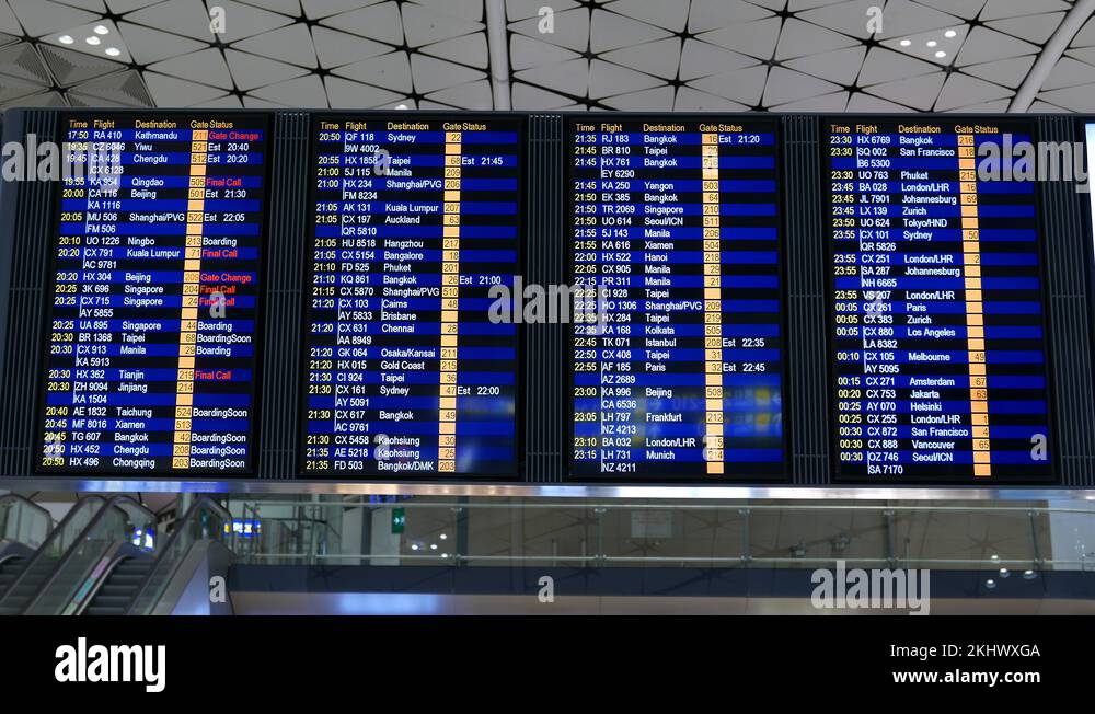 Flight schedule displays at modern airport, list information and gate ...