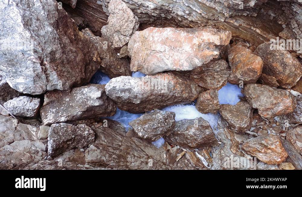 Splashes of water from the waves breaking on the stones. Storm Sea with ...