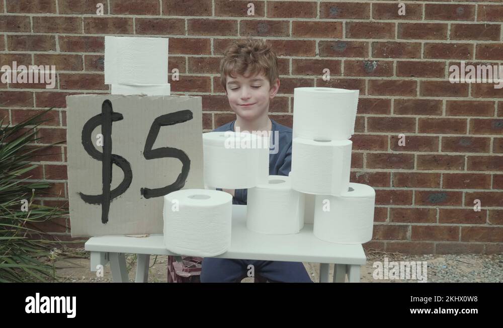 little boy sells toilet paper rolls from his stand for 5 dollars each ...