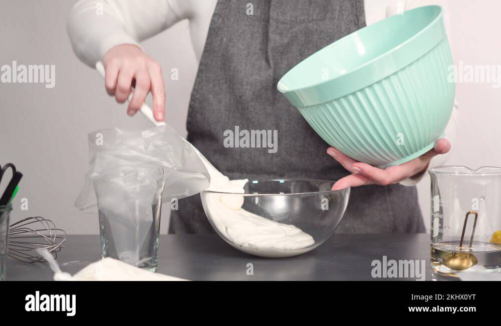 Mixing in food coloring into the royal icing to decorate sugar cookies ...