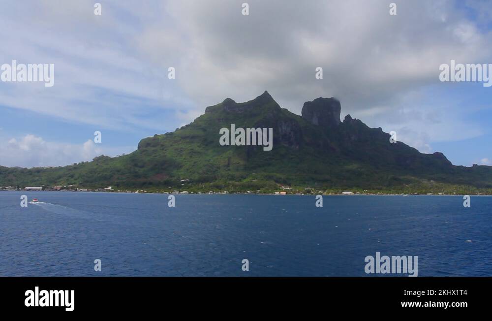 Bora Bora view of an extinct volcano across the lagoon Stock Video ...