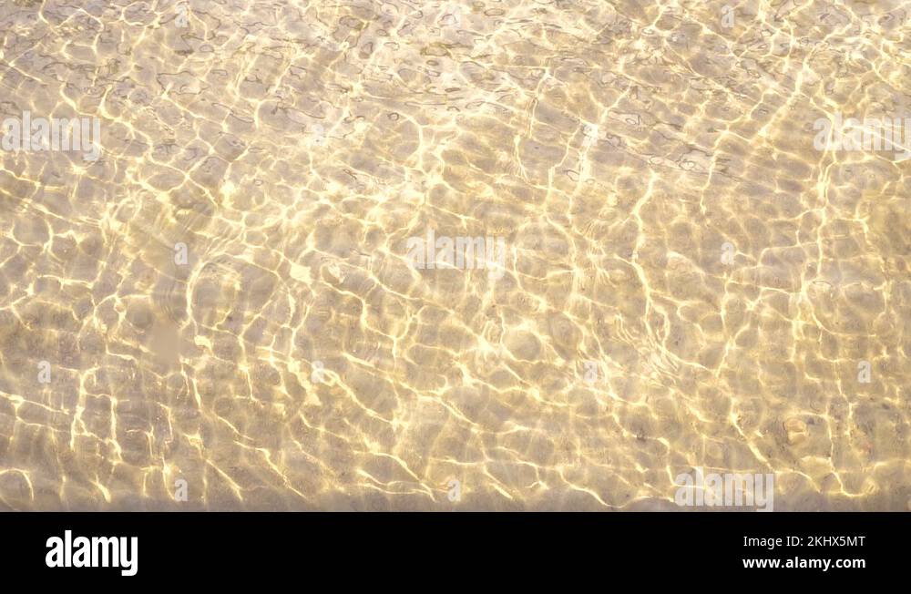 Water surface texture, Slow motion looping clean swimming pool ripples ...