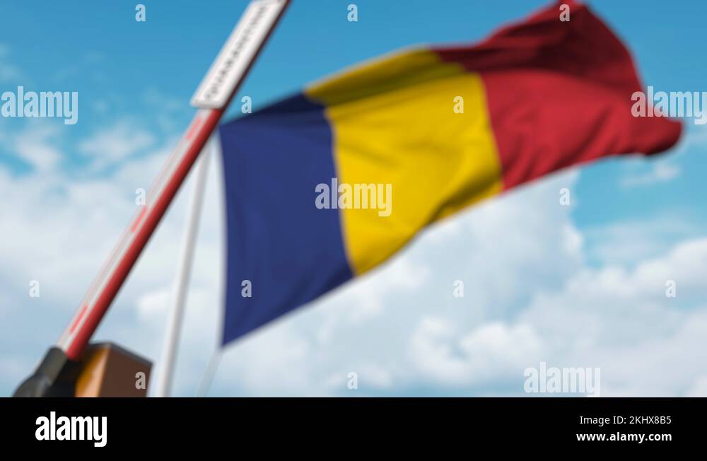 Closed boom gate with QUARANTINE sign on the Romanian flag background ...