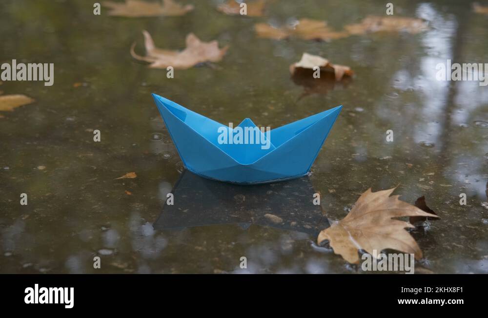 Paper boat puddle Stock Videos & Footage - HD and 4K Video Clips - Alamy