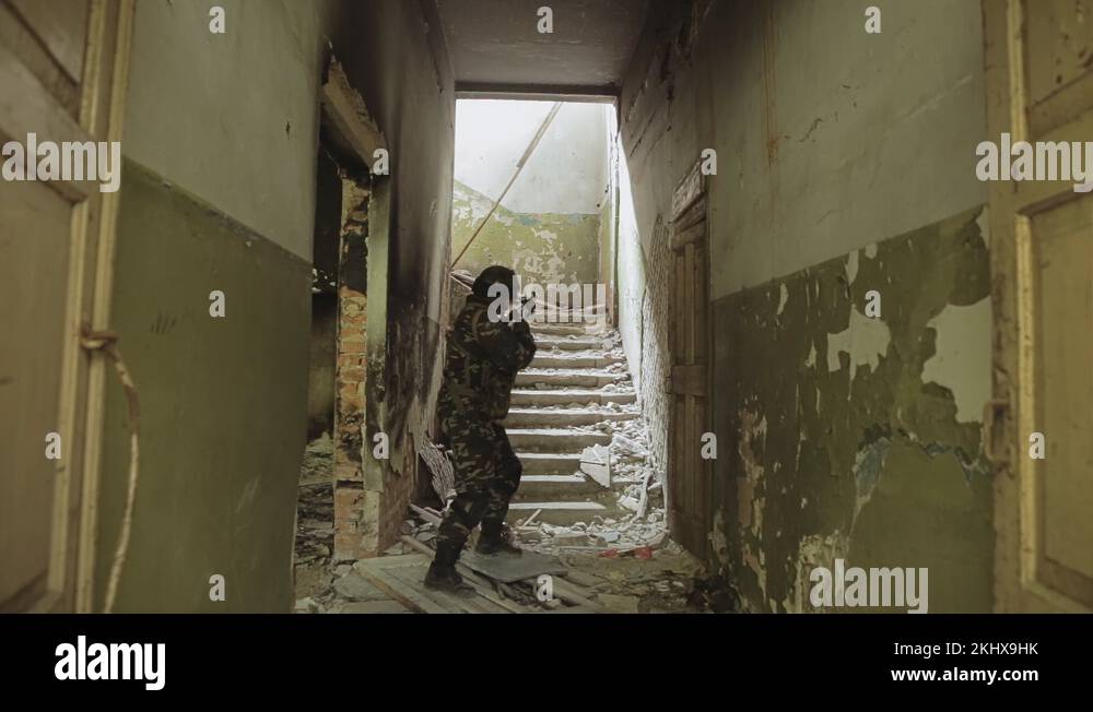 The girl the soldier climbs on the dusty stairs. Storming the second ...