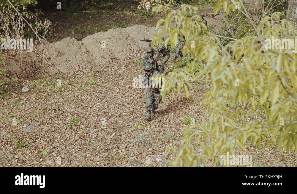 A detachment of special forces soldiers surrounds the building for the ...