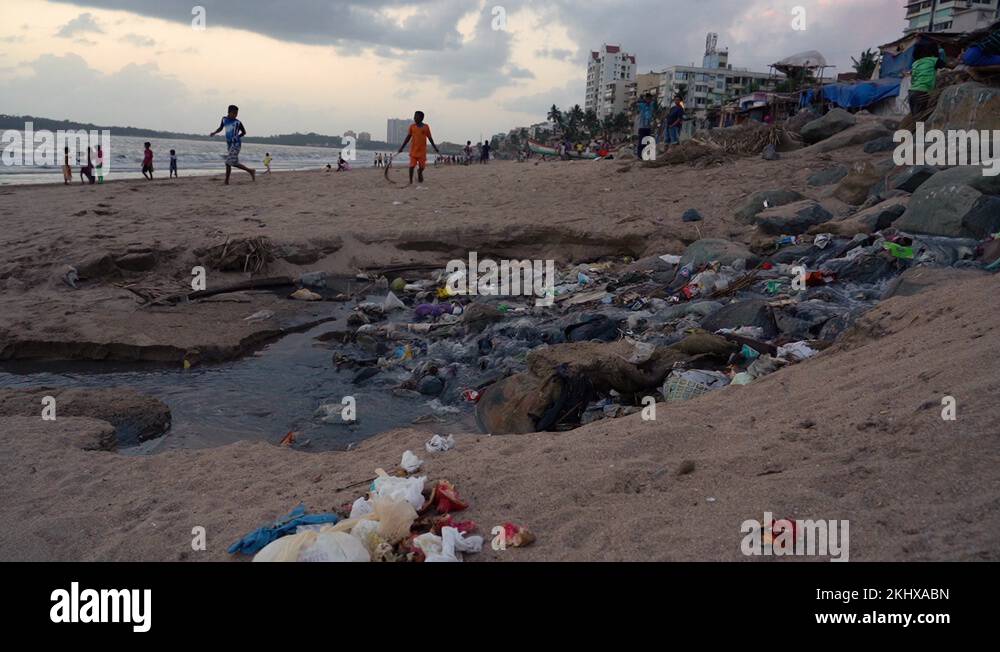 Indian kids playing near garbage at a beach in Mumbai Stock Video ...