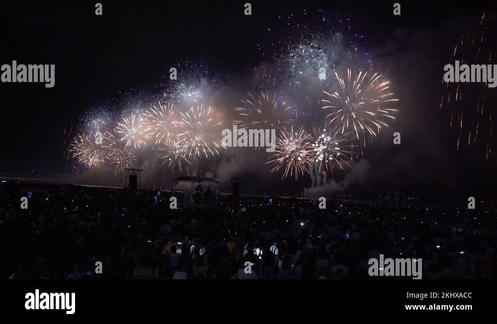shining fireworks lights in night sky. New year's eve fireworks ...