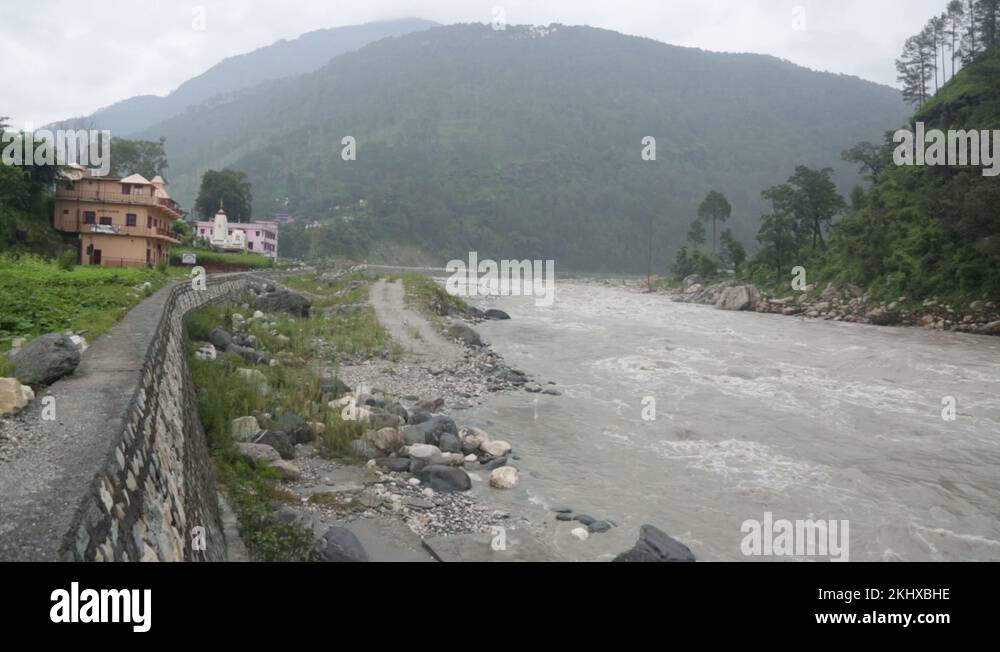 Himalaya mountainous river Ganges flowing through Himalaya villages ...