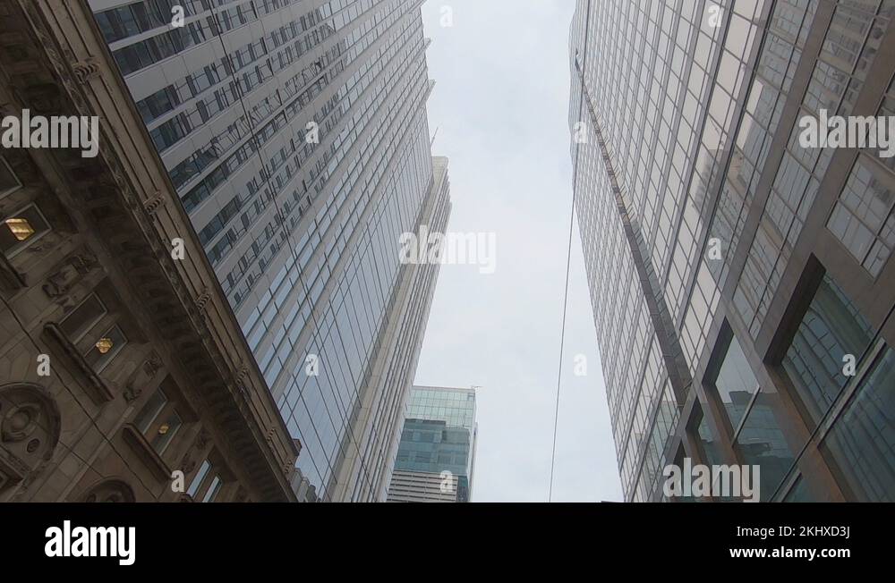 POV tilt up office towers buildings and financial district in Toronto ...