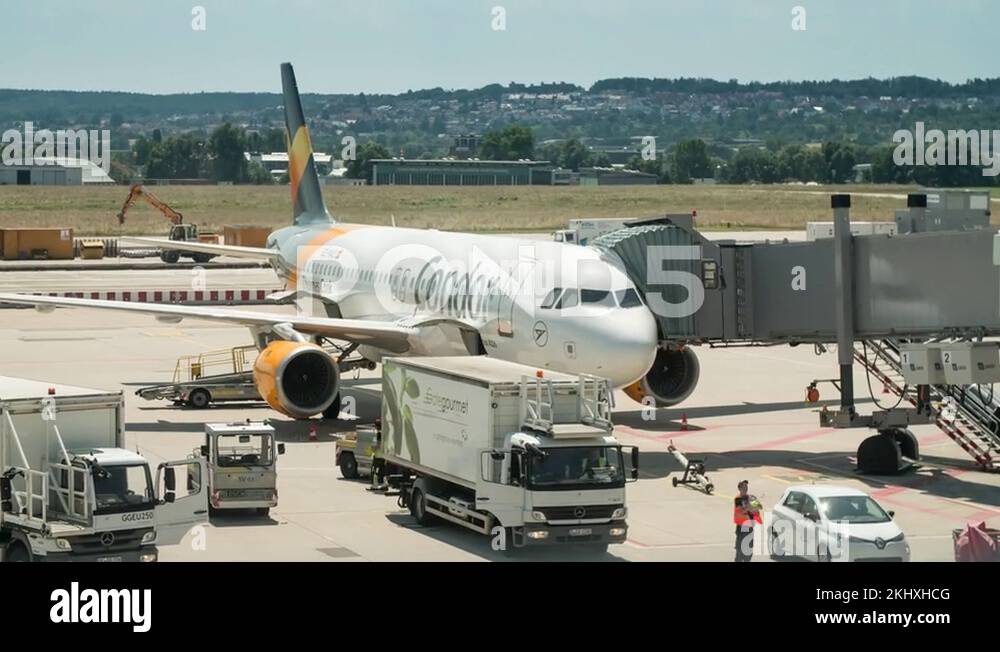 Airplane at the Airport Apron Area. Jetway bridge retraction before the flight Stock Video ...