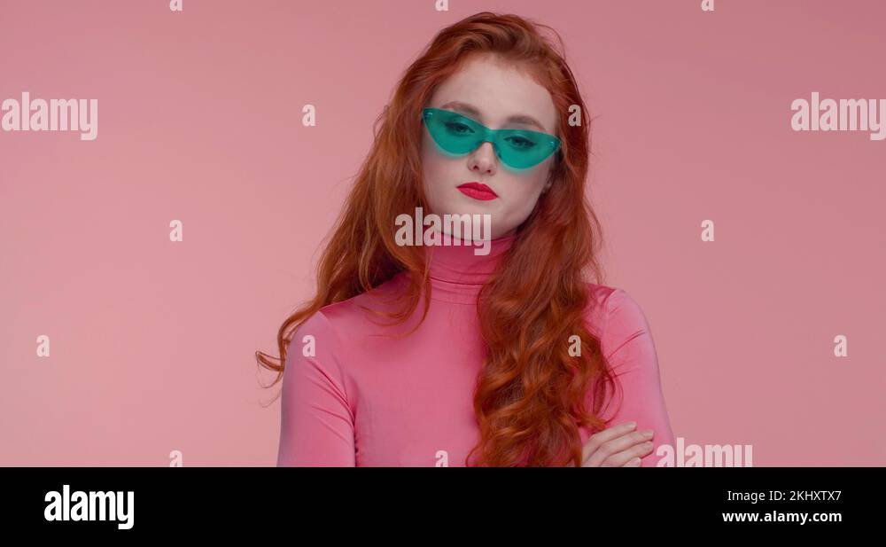 Beautiful female Model chews Gum and posing on Camera, looking ...