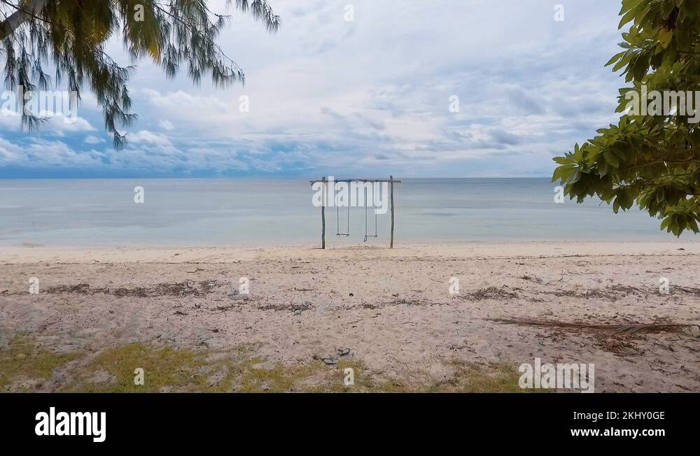Wooden swing on the seafront on Sula Island, North Maluku, Indonesia ...