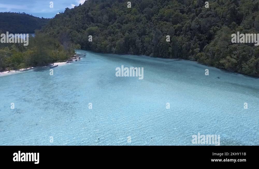 Drone approach on a transparent boat on transparent waters at Sula ...