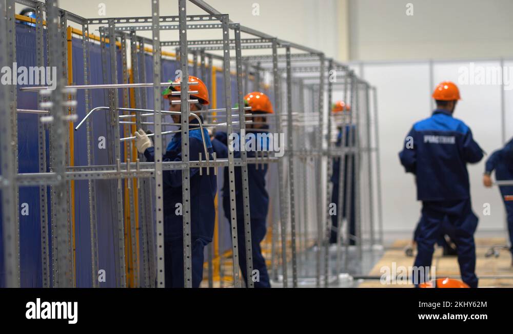 Guys install metal structure from channels bars. Working environment at ...