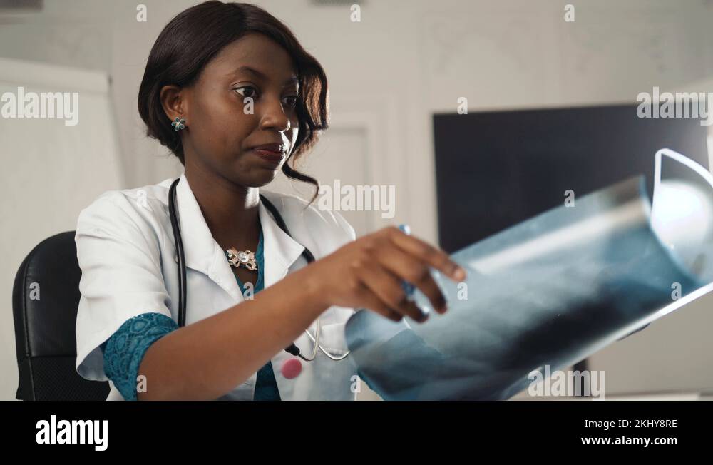 Scientist, Microbiologist or Doctor, black woman checking examining ...