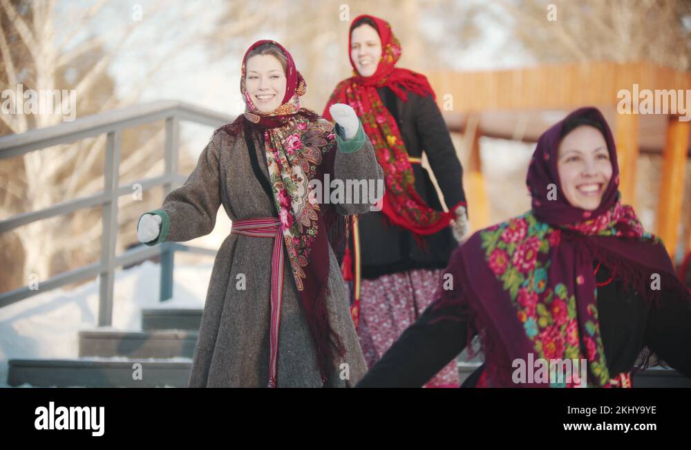 Russian folklore - man is clapping to women in scarves who smiling and ...