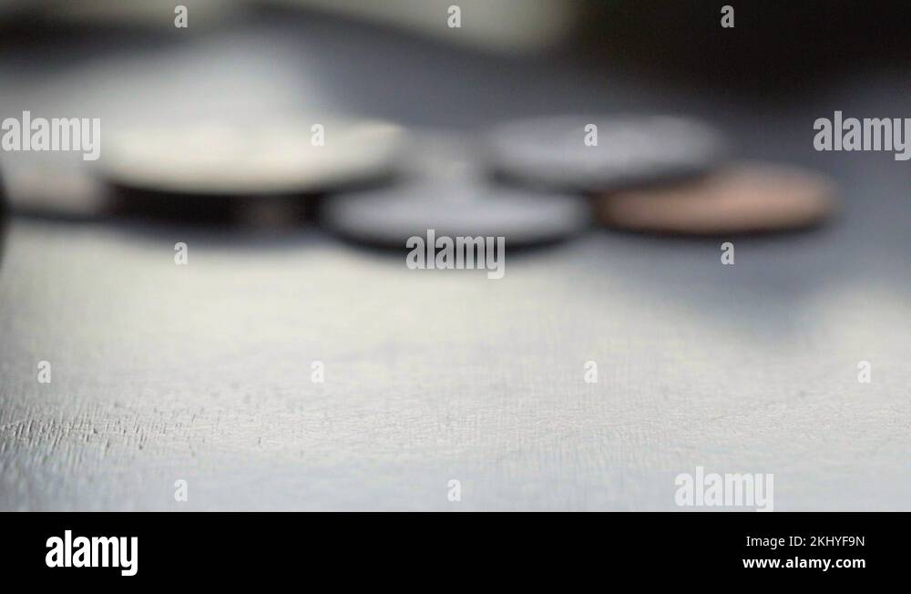 Extreme closeup of US penny spinning and falling in slow motion in ...
