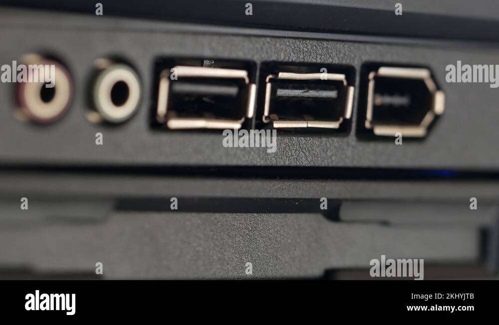 USB cable is inserted into socket. Black panel with colored connectors ...