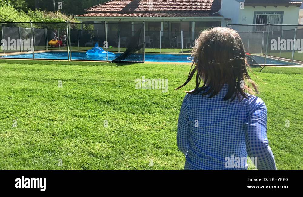 Little girl child running and jumping into swimming pool water Stock ...