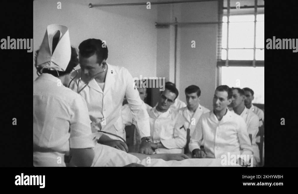 Female Nurse Supervises Vocational Training Of Male Nurses At work With ...